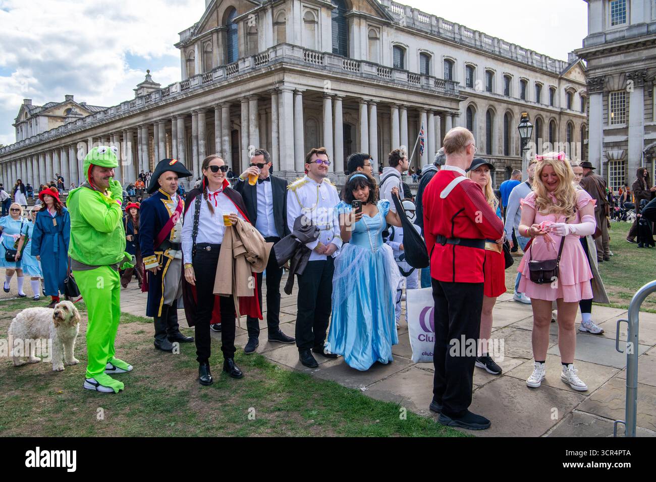 Crowds in costume gather at the Old Royal Naval College, setting a ...