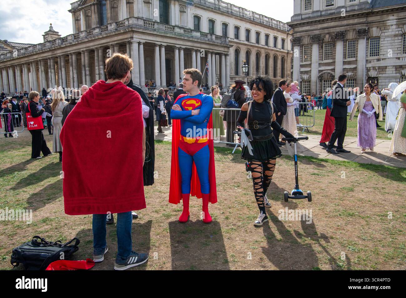Crowds in costume gather at the Old Royal Naval College, setting a ...