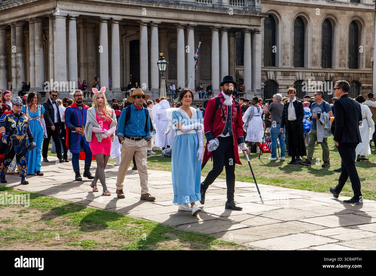 Crowds in costume gather at the Old Royal Naval College, setting a ...