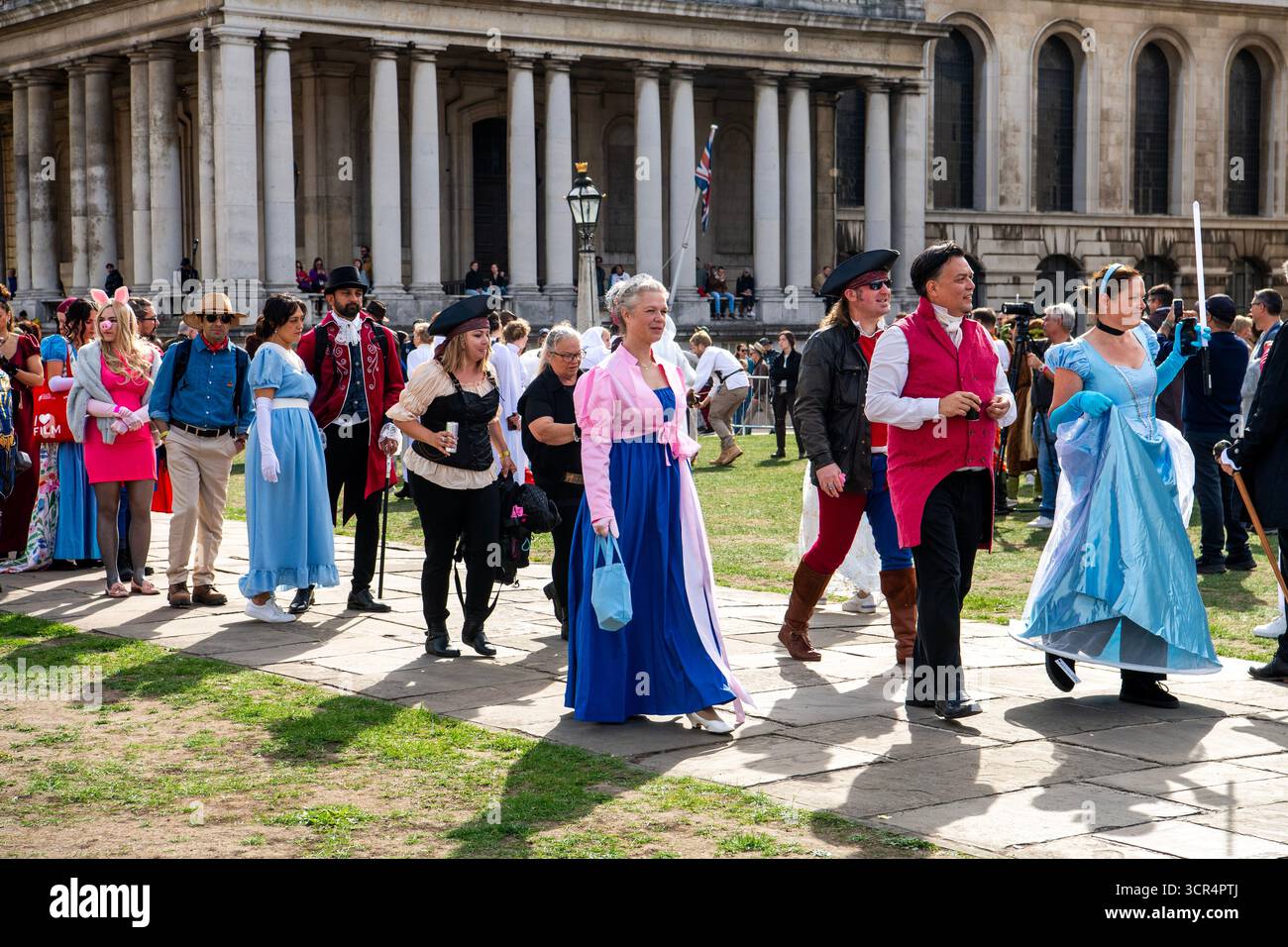 Crowds in costume gather at the Old Royal Naval College, setting a ...