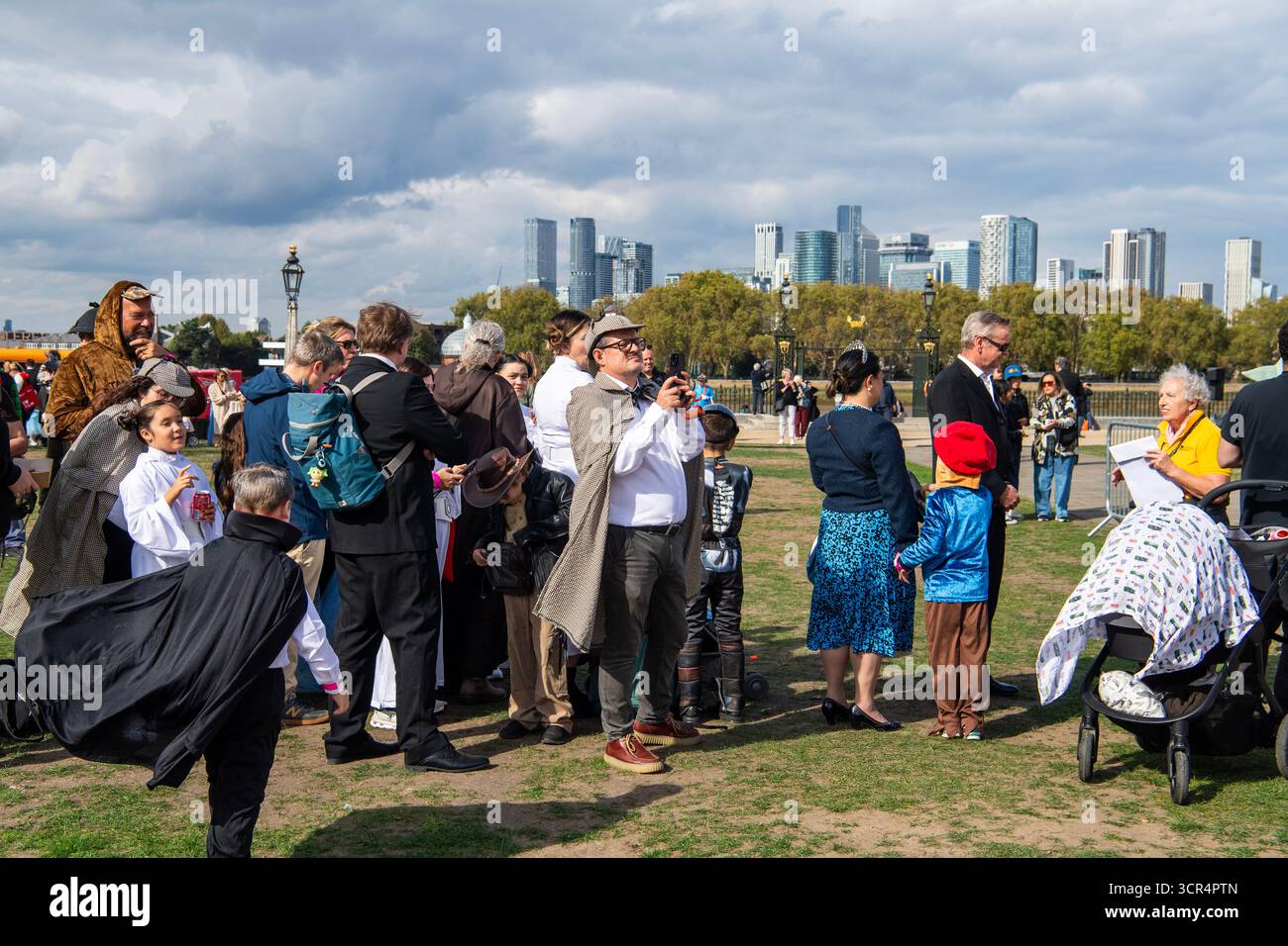 Crowds in costume gather at the Old Royal Naval College, setting a ...