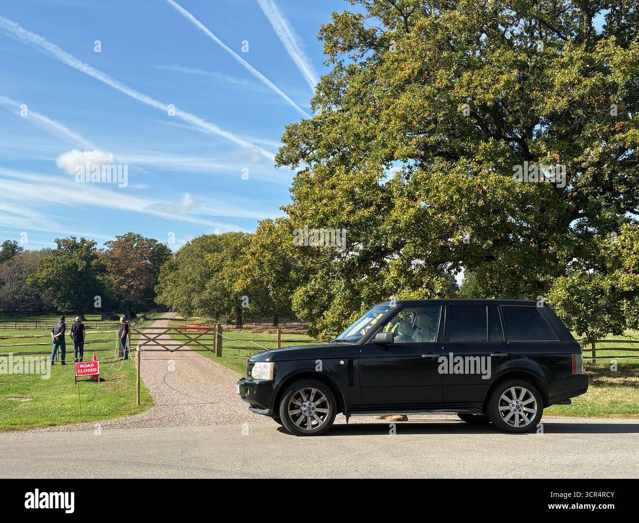 A view of workmen near the gate at the entrance to Forest Lodge in ...