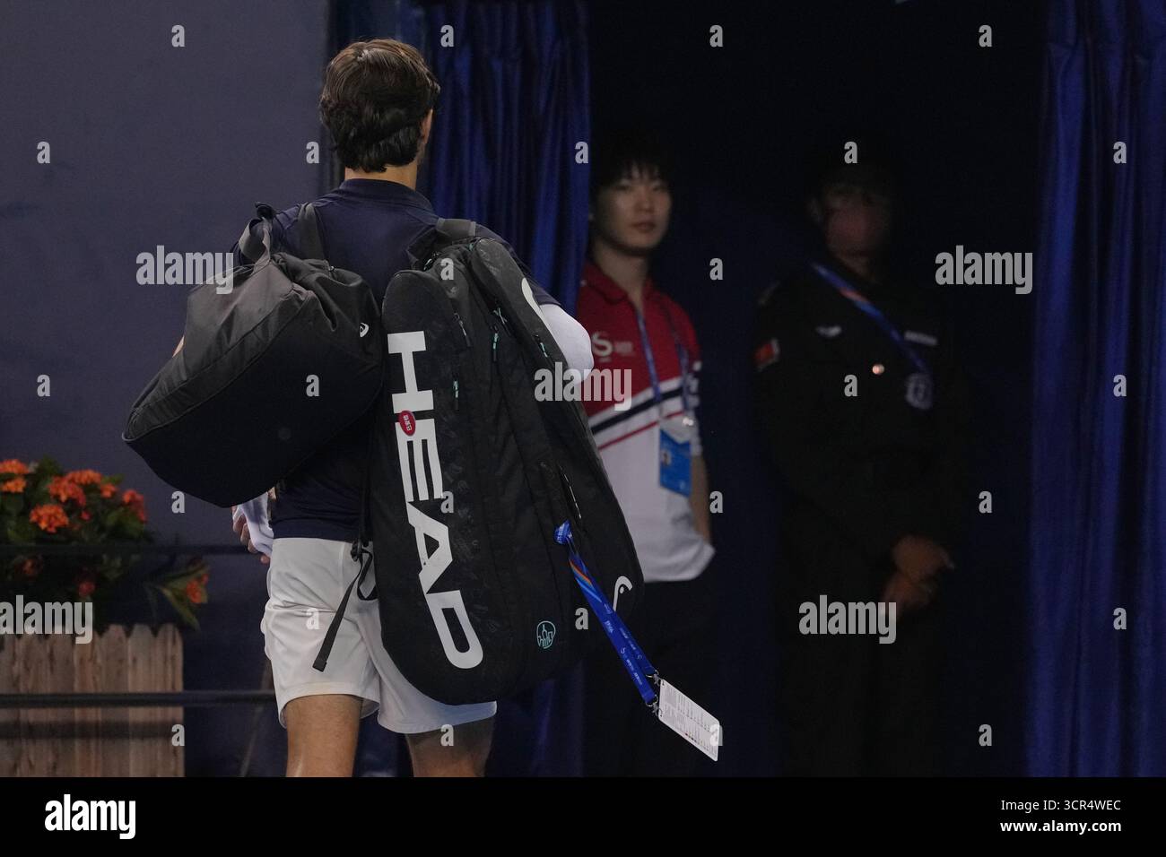 Lorenzo Musetti, of Italy leaves the court after retired from the men's ...