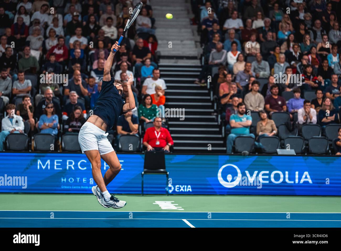 Clement Chidekh (FRA) smashing the ball during the doubles final of the ...