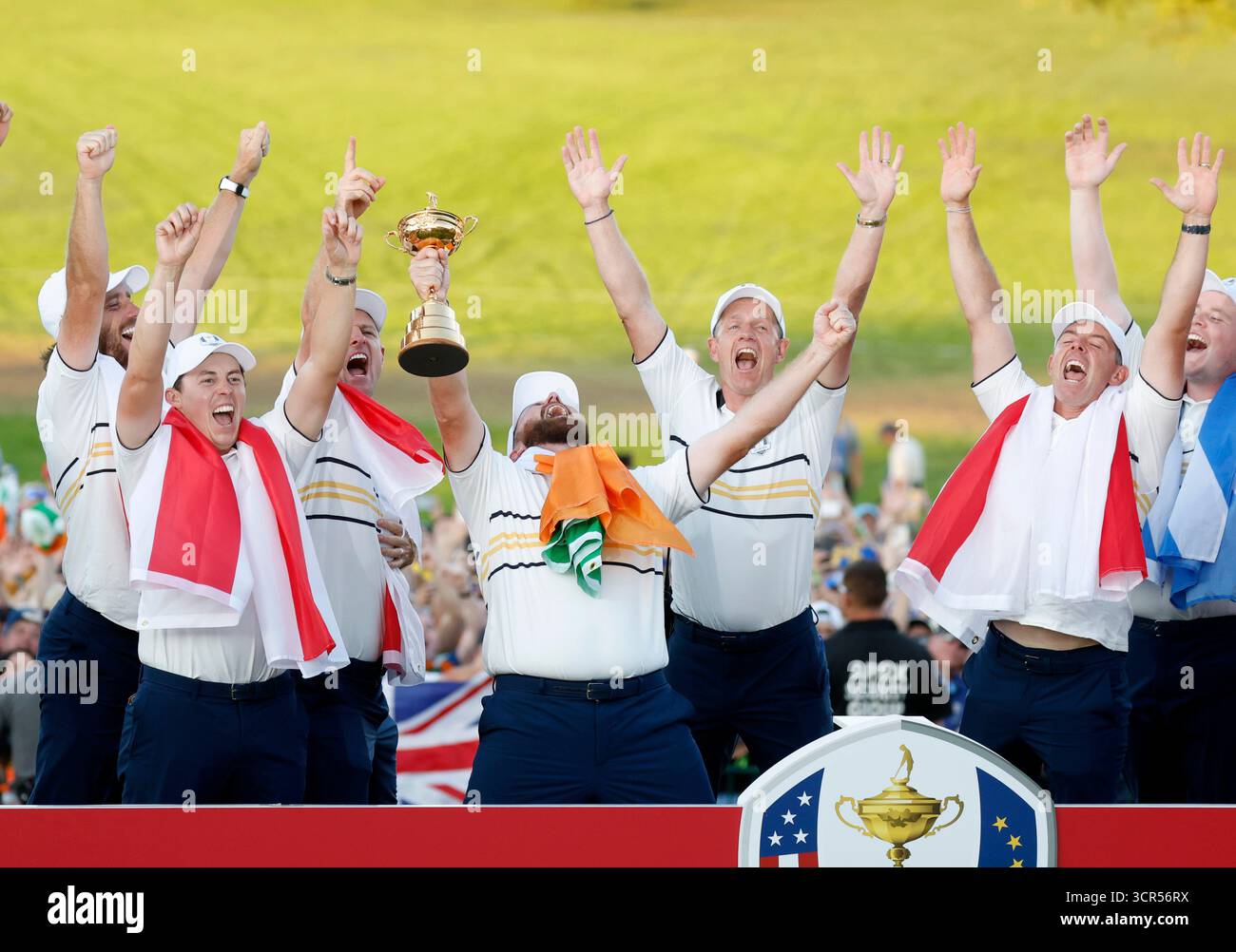 Shane Lowry holds the championship trophy as he celebrates with ...