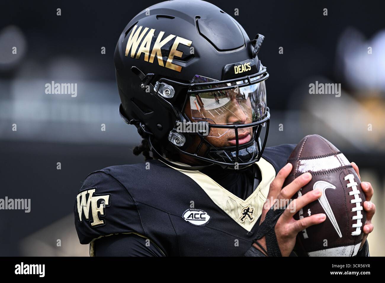 Wake Forest quarterback Robby Ashford (2) warms up during the first ...