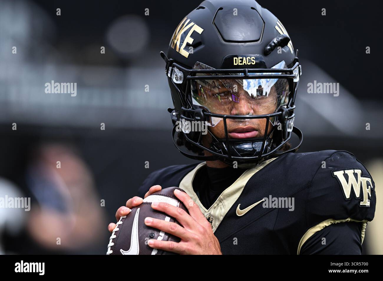 Wake Forest quarterback Robby Ashford (2) warms up during the first ...