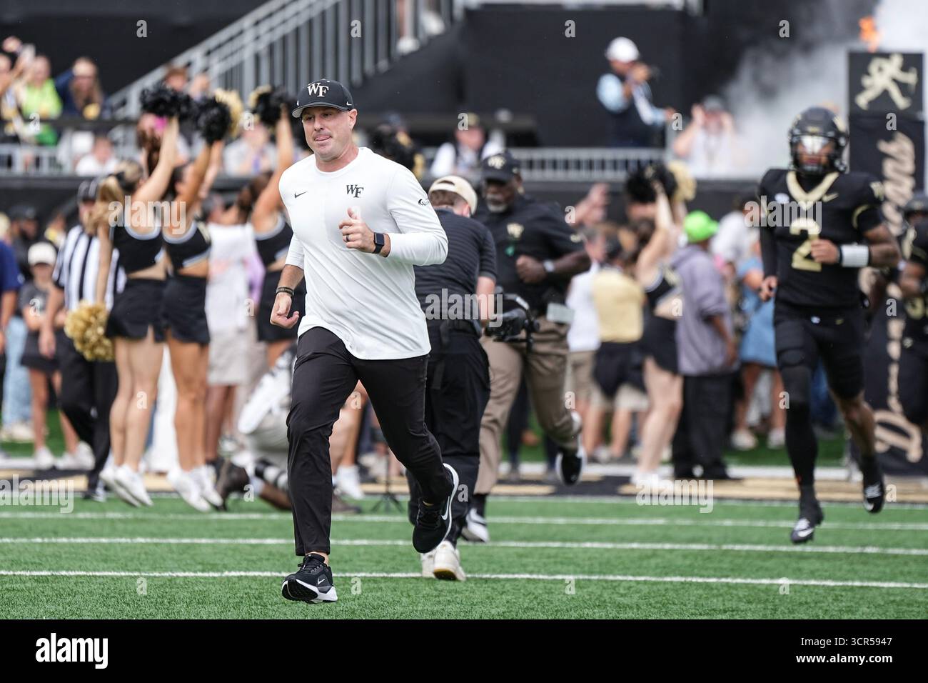 Wake Forest head coach Jake Dickert runs onto the field prior to an ...