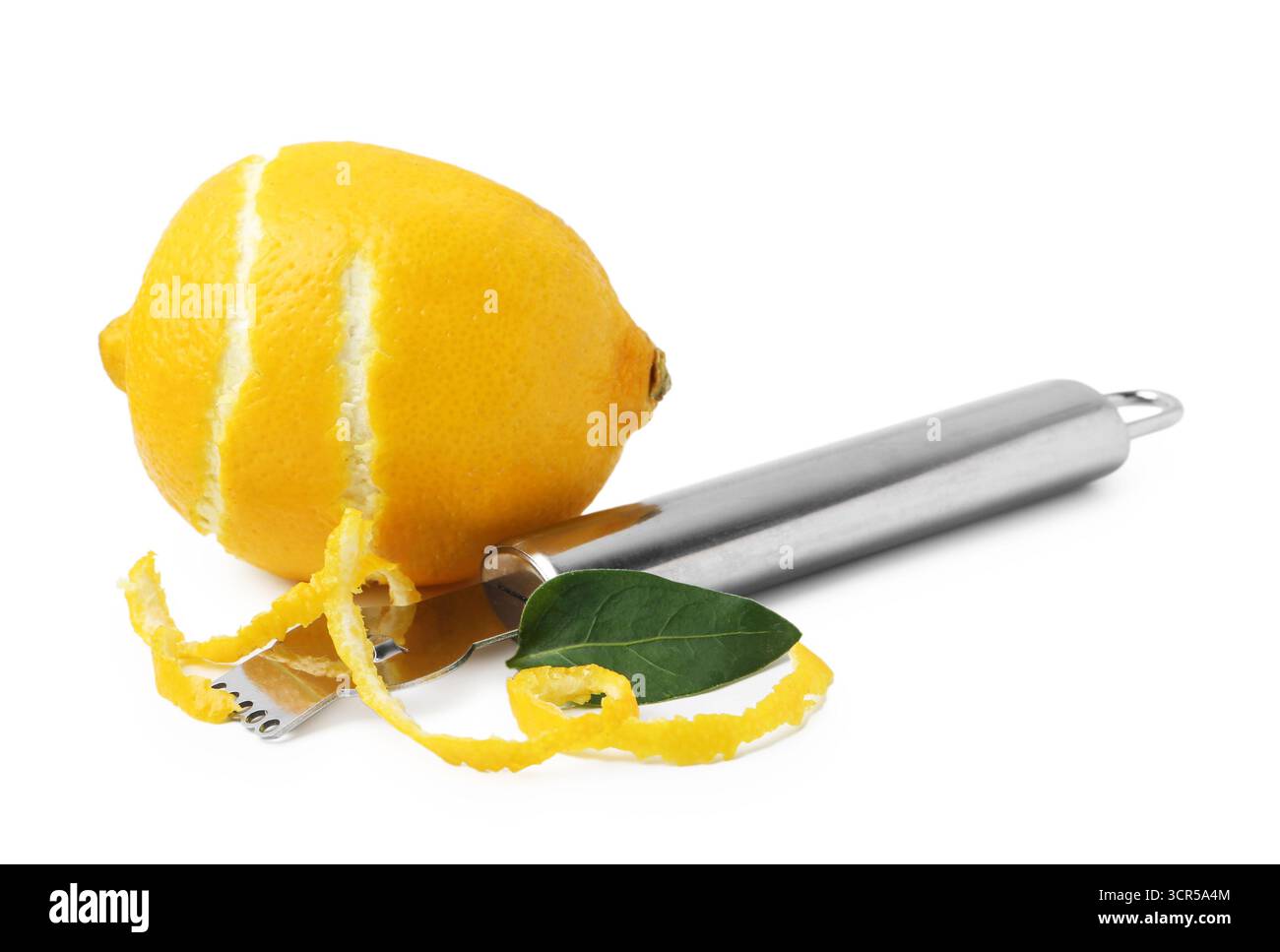 Citrus zester on lemon skin hi-res stock photography and images - Alamy