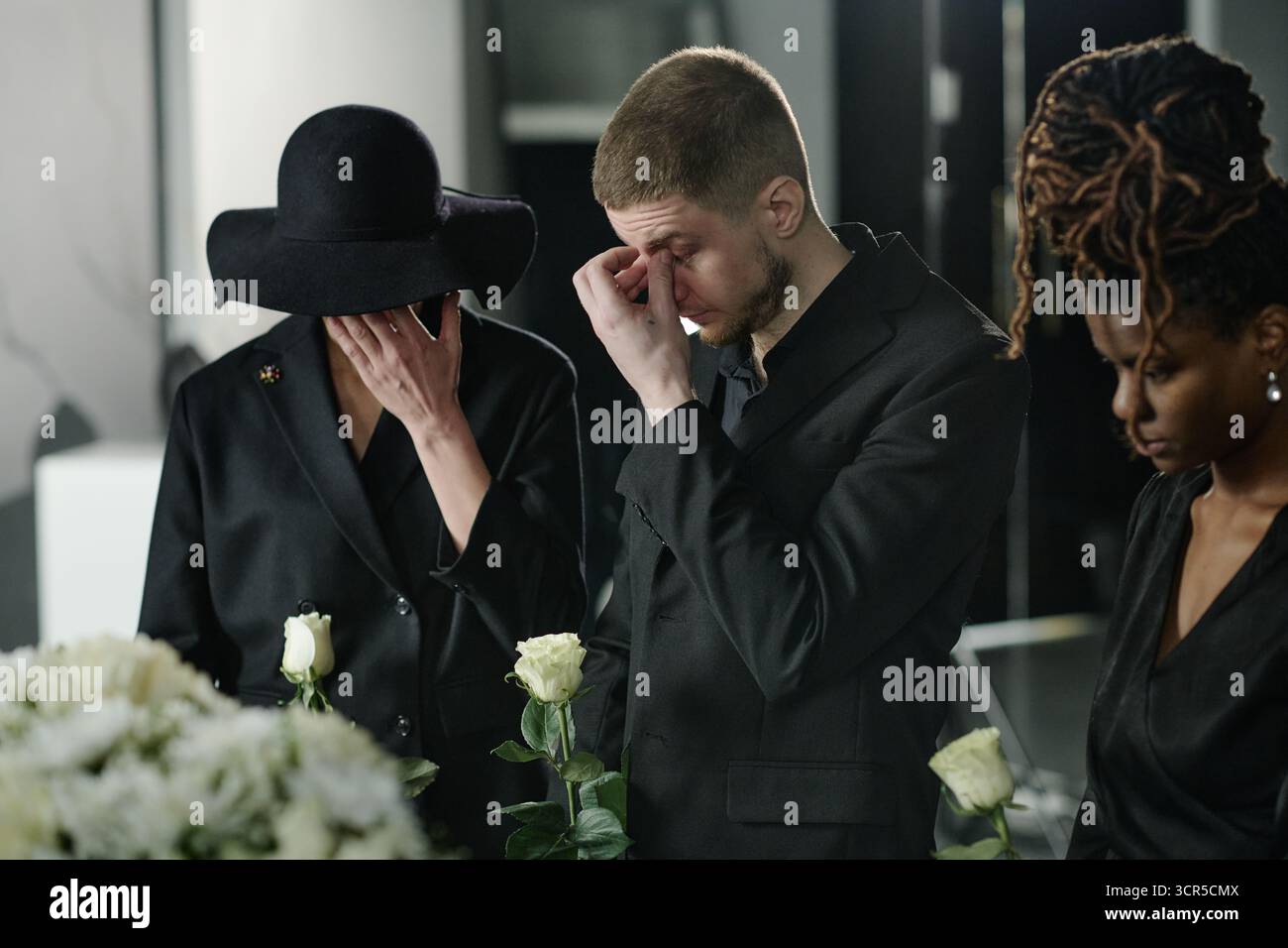 Group people mourning funeral young hi-res stock photography and images ...