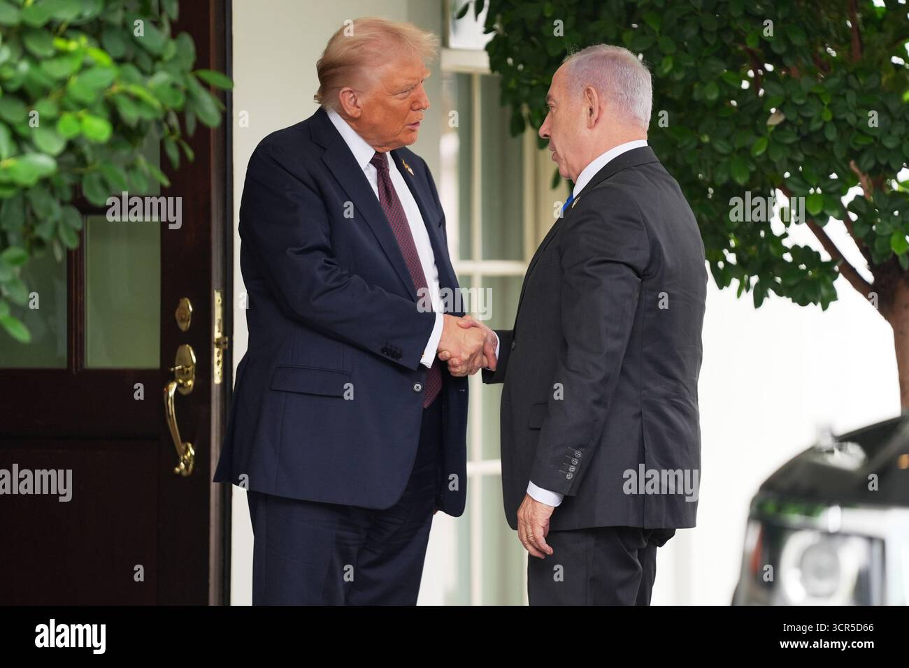 President Donald Trump, left, shakes the hand of Israeli Prime Minister ...