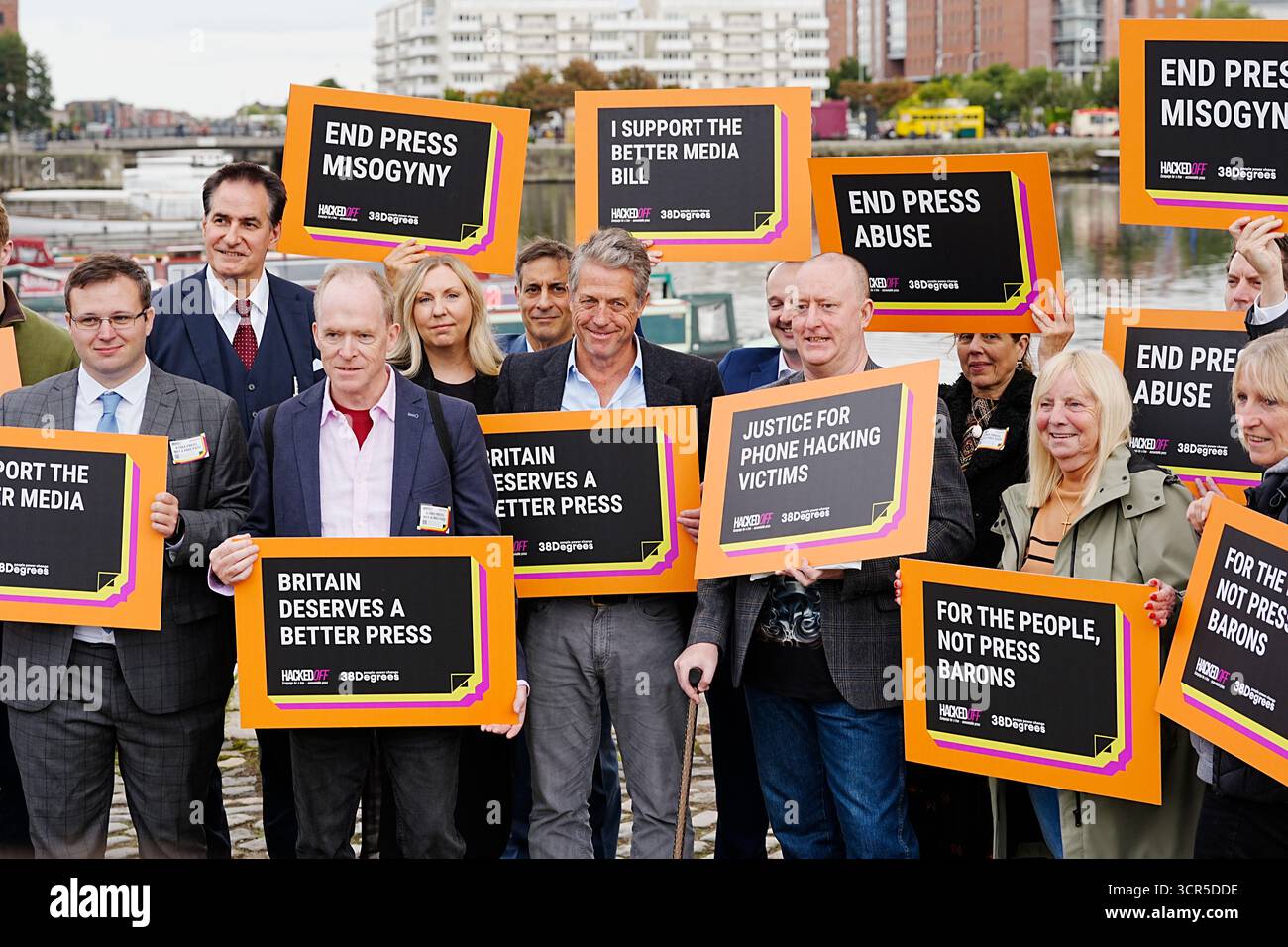 Hugh Grant (centre) joins campaigners from Hacked Off and 38 Degrees ...
