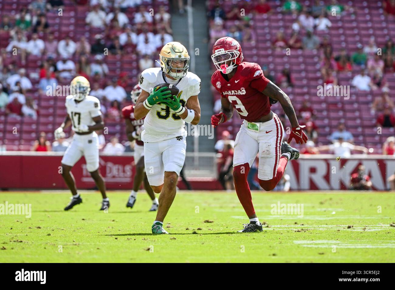 Notre Dame wide receiver Matt Jeffery, left, catches a pass in front of ...