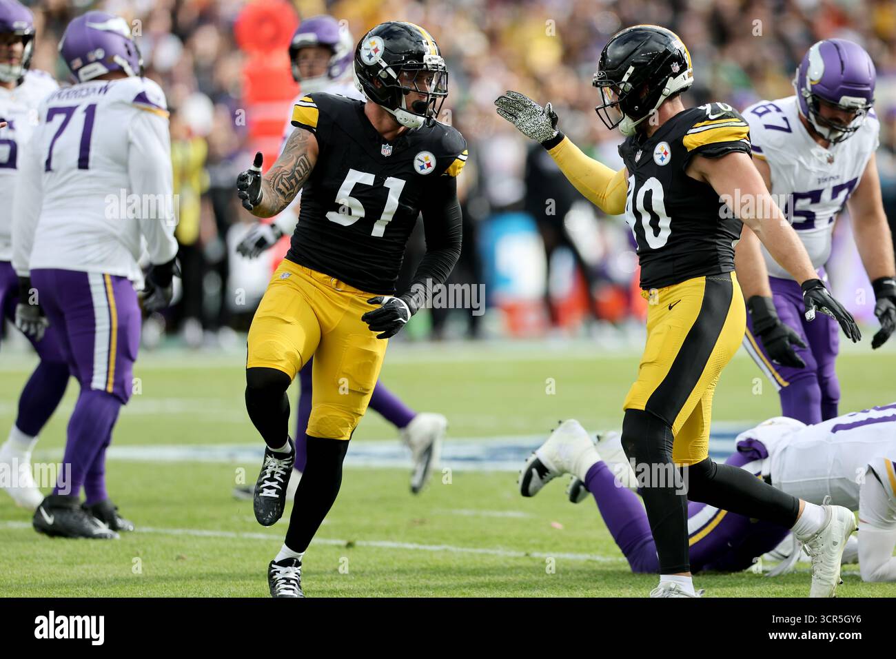 Pittsburgh Steelers TJ Watt (90) and Nick Herbig (51) celebrate a sack ...