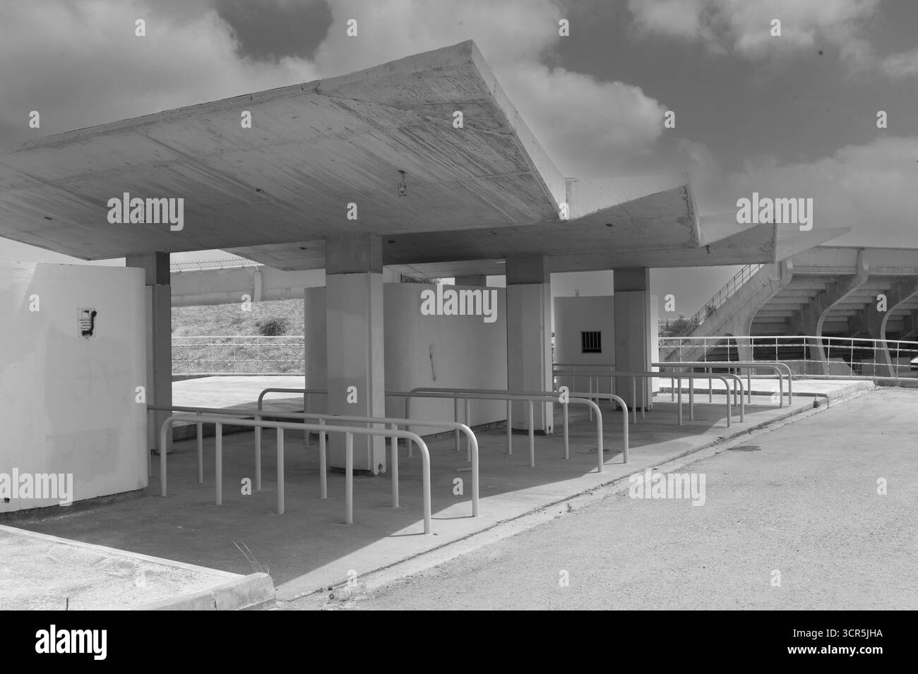 Entrance to Pafos football ground via brutalist concrete entrance gates ...