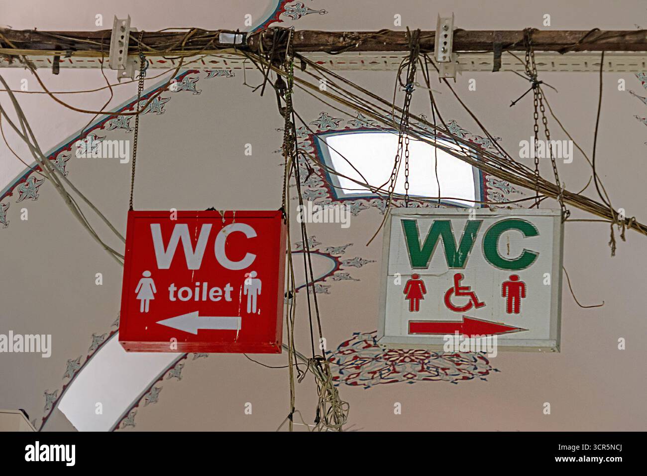 Toilet WC signs boards outside on Istanbul street with arrows showing ...