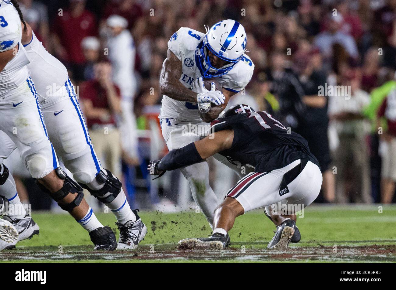 Kentucky running back Seth McGowan (3) is tackled by South Carolina ...