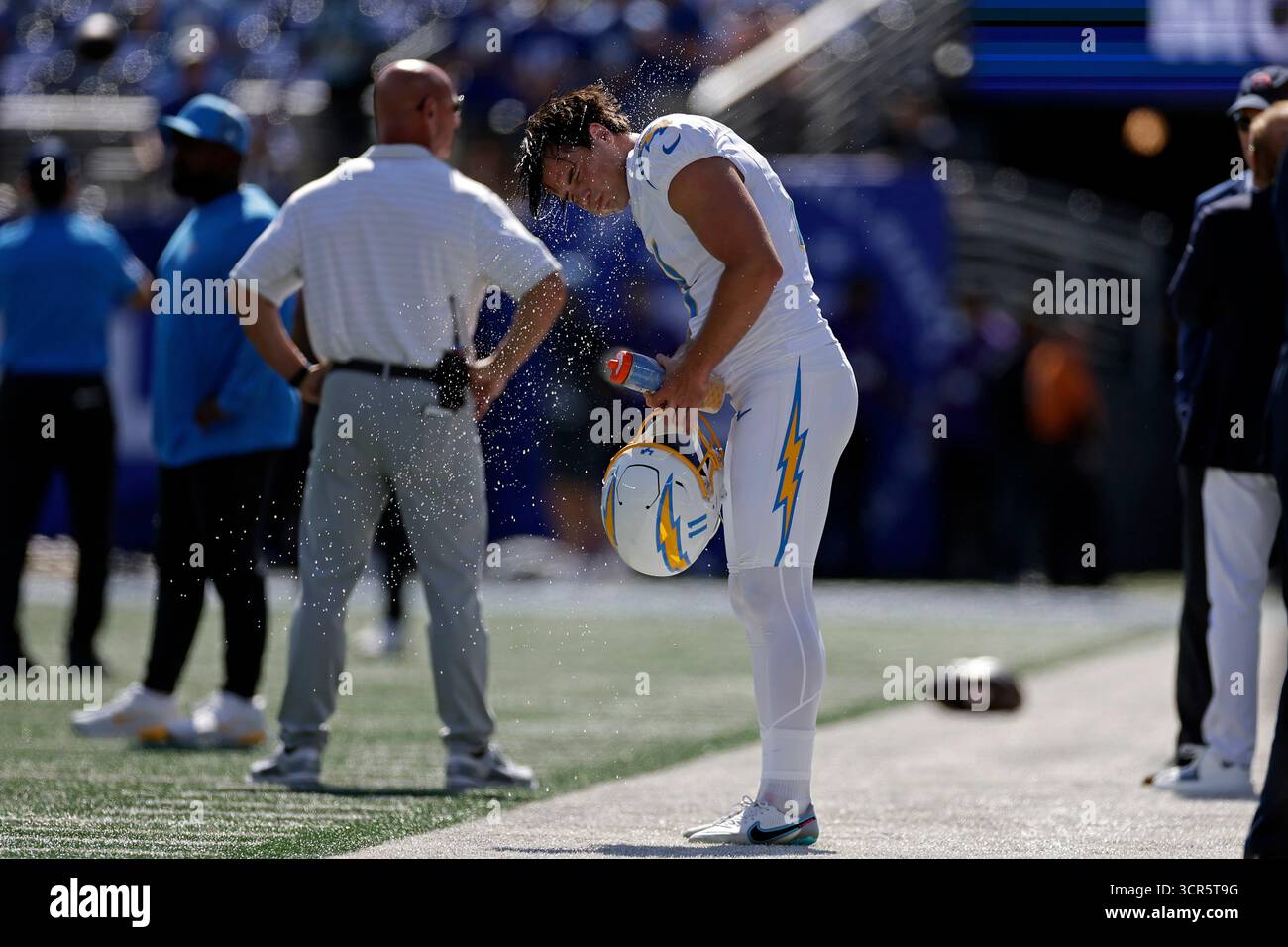 Los Angeles Chargers kicker Cameron Dicker (11) shakes water off his ...