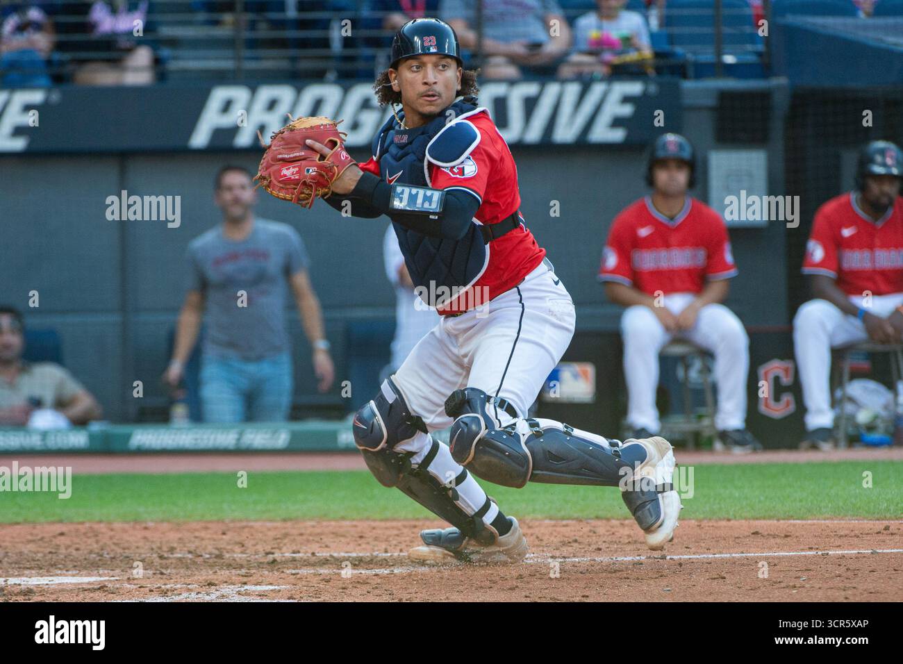 Cleveland Guardians' Bo Naylor looks to throw to first base after ...