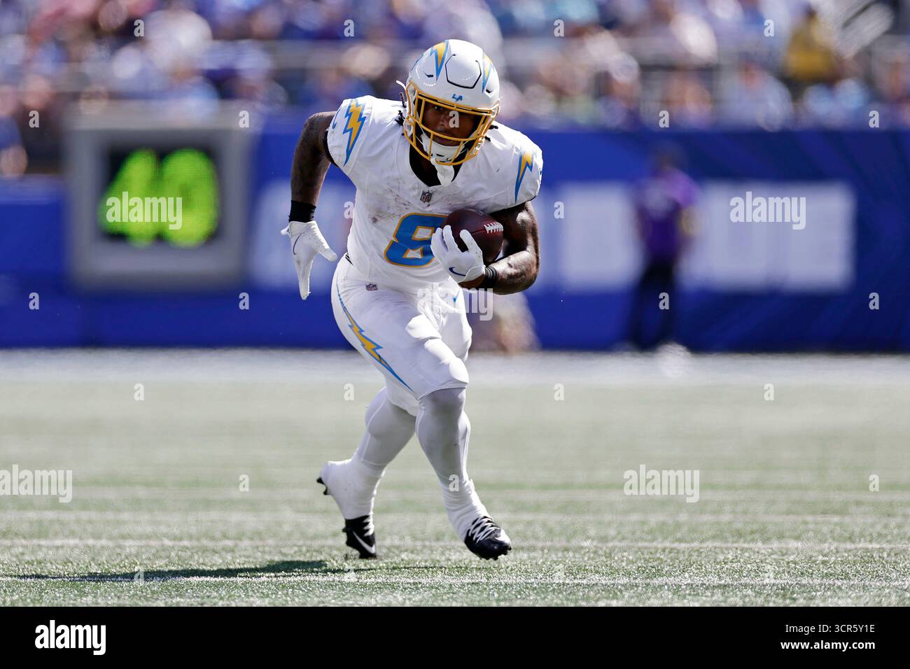 Los Angeles Chargers running back Omarion Hampton (8) runs with the ...