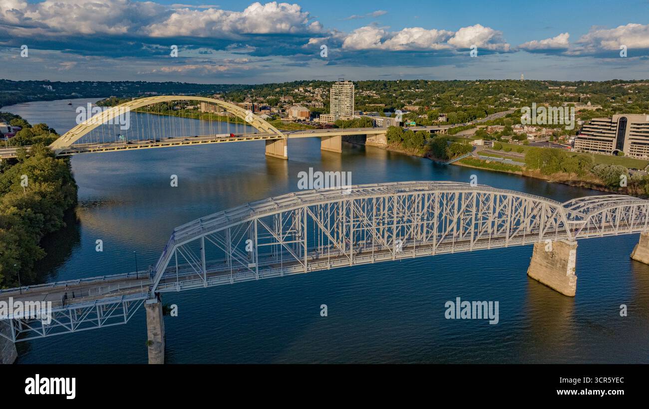 Aerial view of bridges spanning the river, connecting the cityscape ...