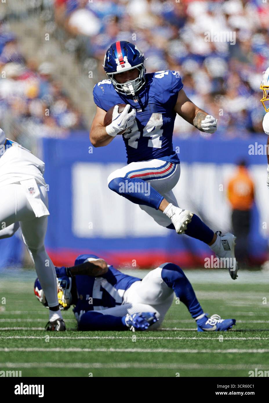 New York Giants running back Cam Skattebo (44) runs with the ball ...