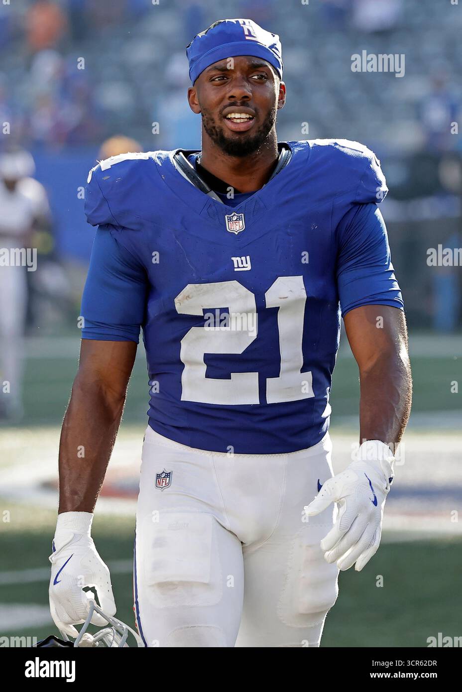 New York Giants cornerback Paulson Adebo (21) runs off the field after ...