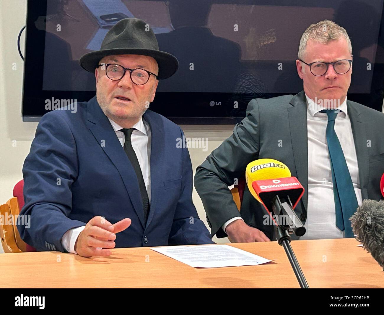 Former MP George Galloway (left) and his solicitor, Kevin Winter (right ...