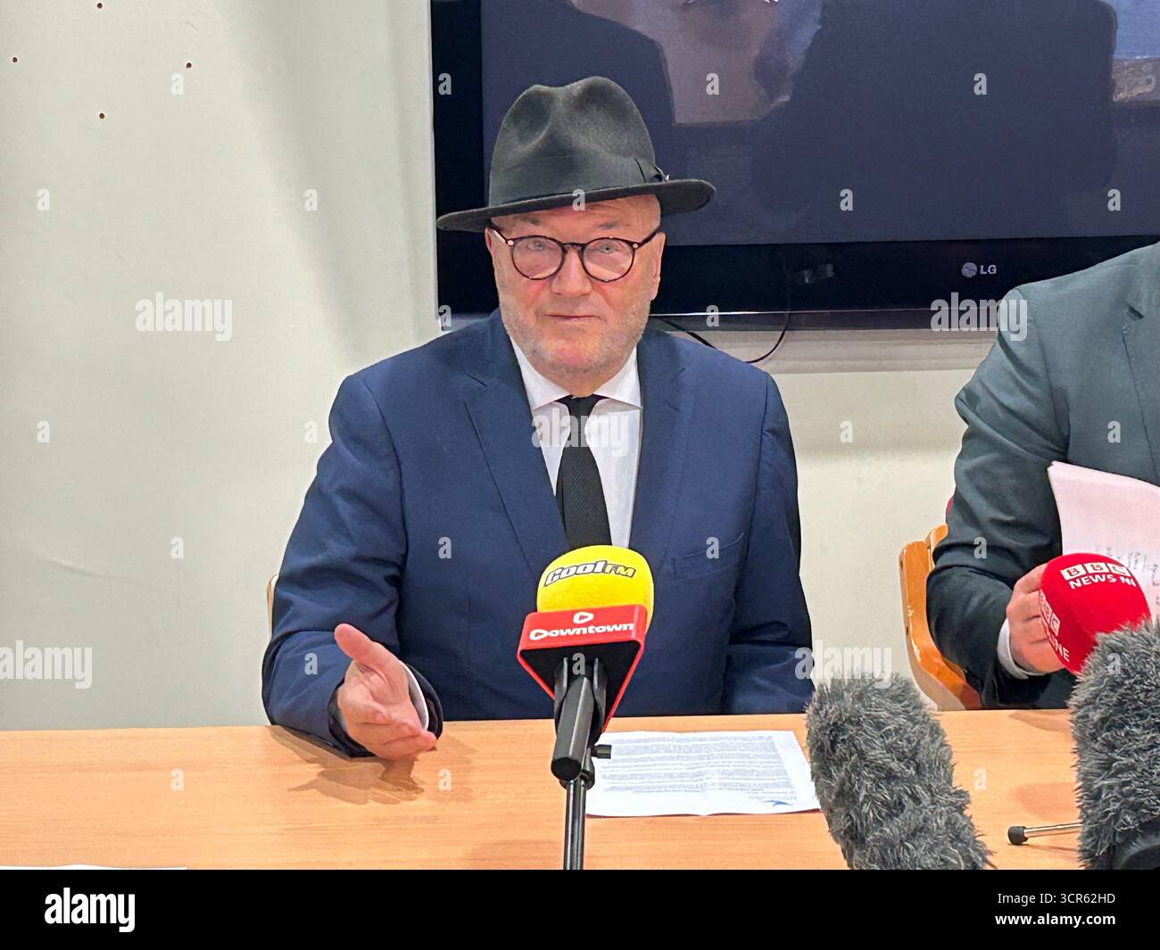 Former MP George Galloway speaks to members of the press alongside his ...