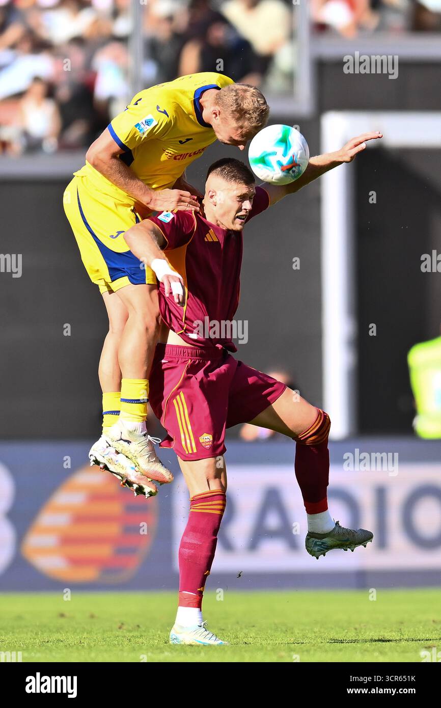Victor Nelsson of Hellas Verona F.C. and Artem Dovbyk of A.S. Roma are ...