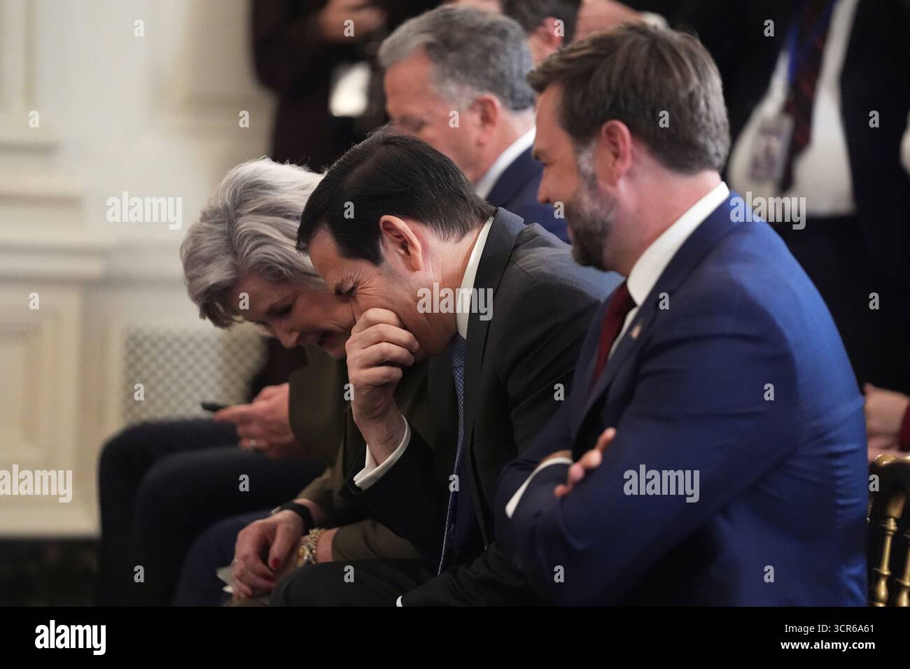 Secretary of State Marco Rubio reacts alongside White House Deputy ...
