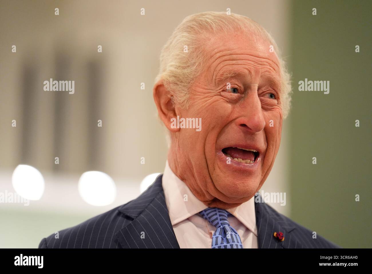King Charles III laughs during a visit to view the Queen Marie of ...