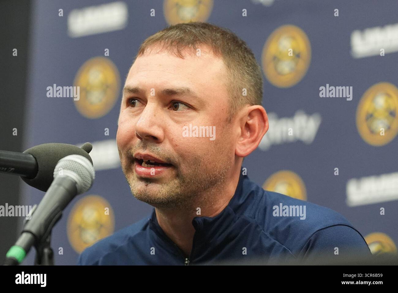 Denver Nuggets head coach David Adelman responds to questions during an ...