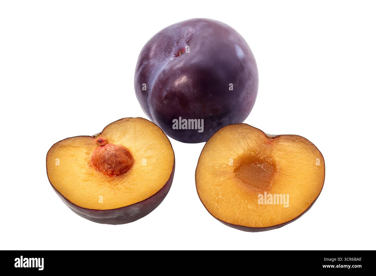 Whole plum and plum cut in half with seed view isolated on white with ...