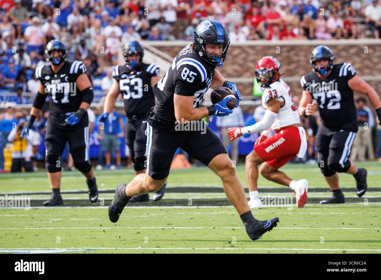 Duke's Jeremiah Hasley (85) carries the ball during an NCAA college ...
