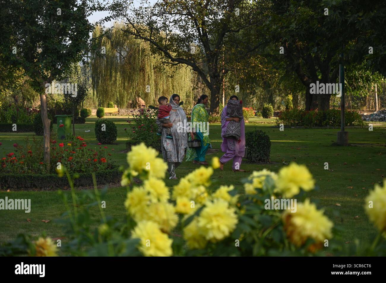 ANANTNAG, INDIA - SEPTEMBER 29: People walk inside the Akad Parkon ...