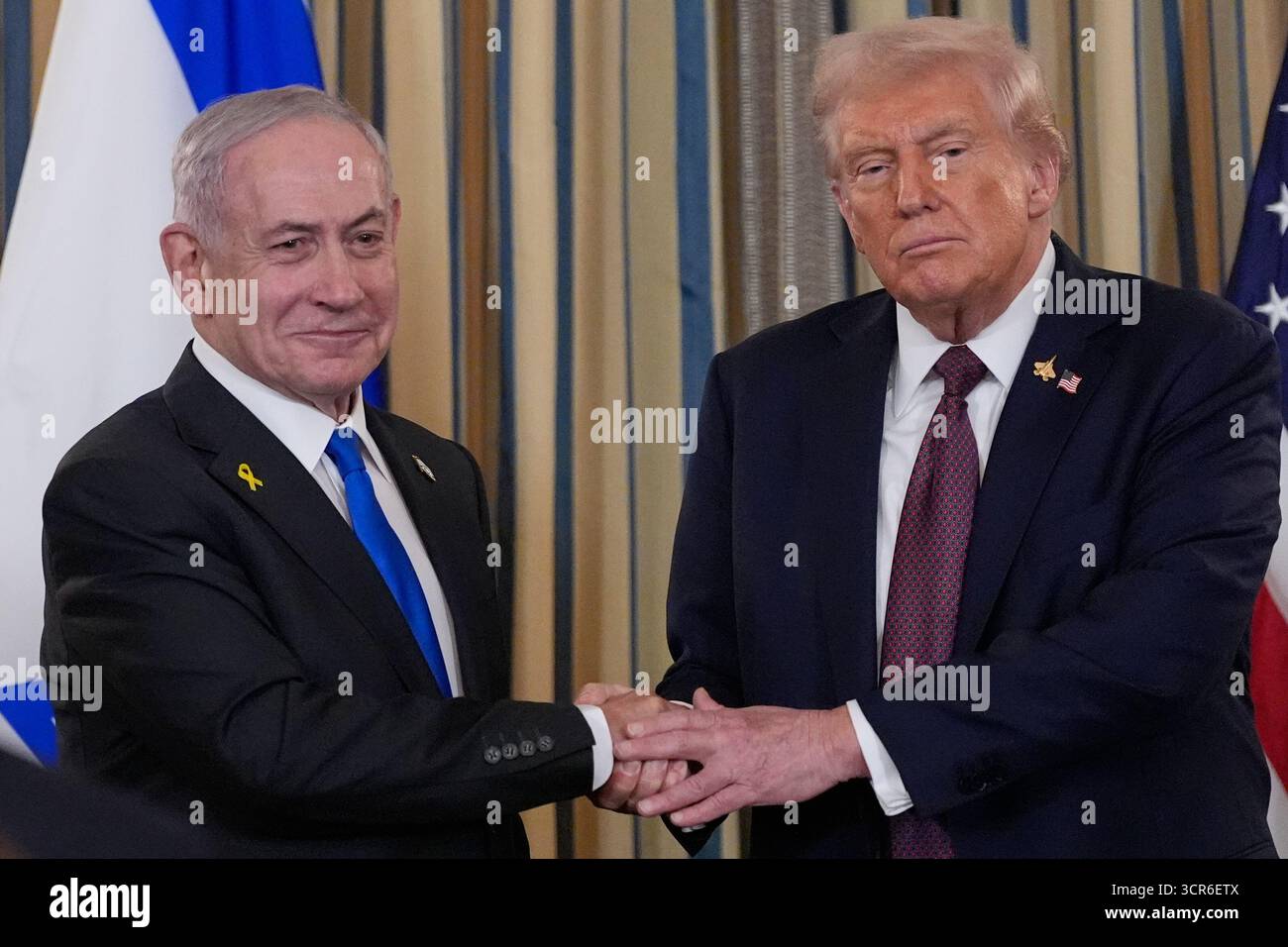 Israel's Prime Minister Benjamin Netanyahu shakes hands with President ...