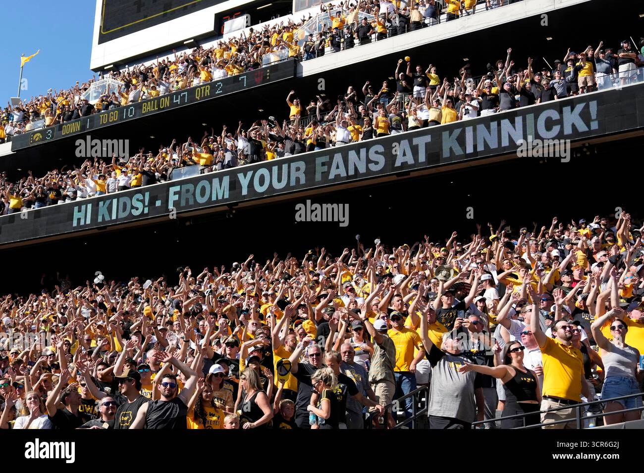 Fans wave to children in the University of Iowa's children's hospital ...