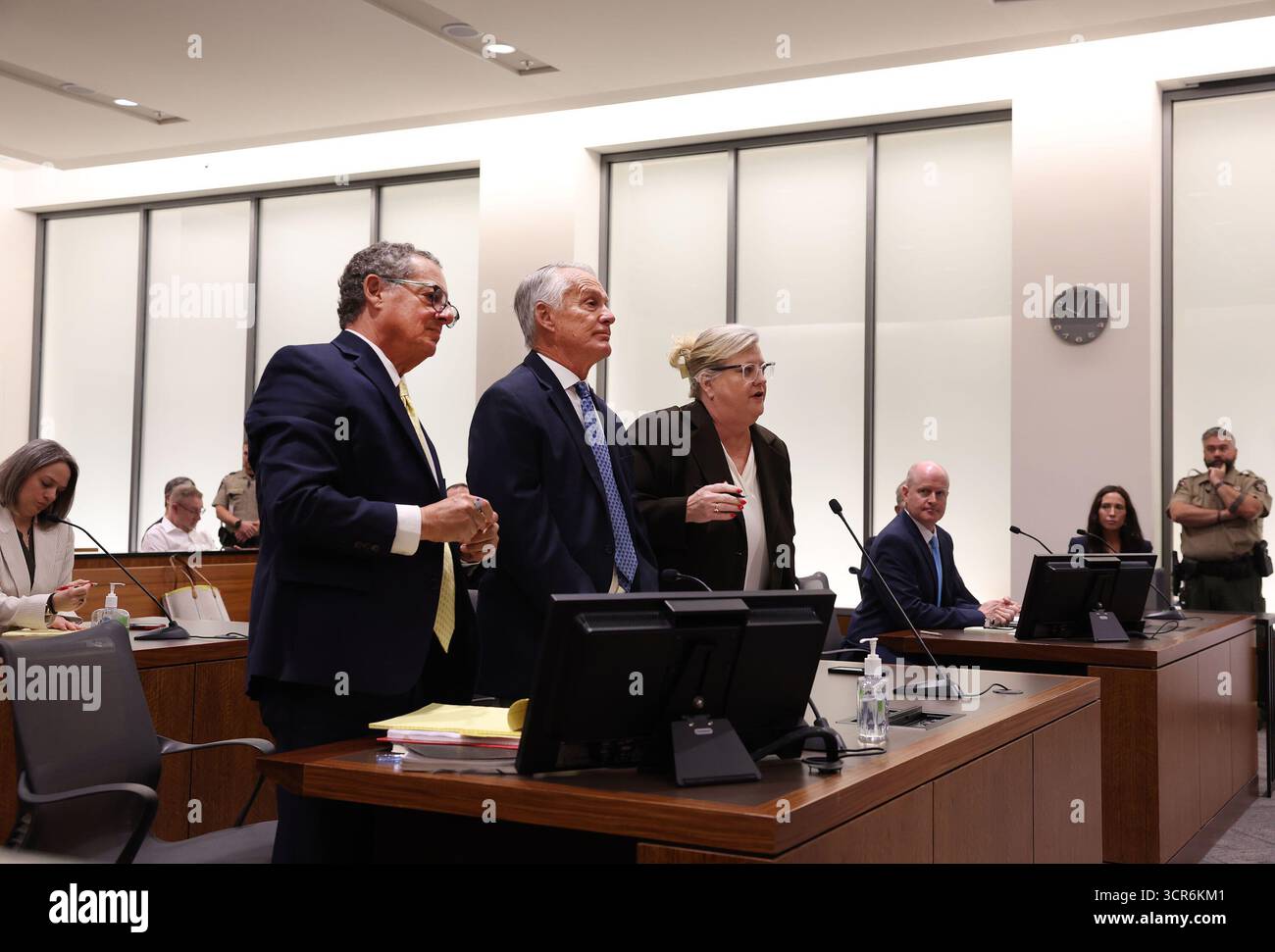 Defense attorneys Richard G. Novak, left, Michael N. Burt, and Kathryn ...