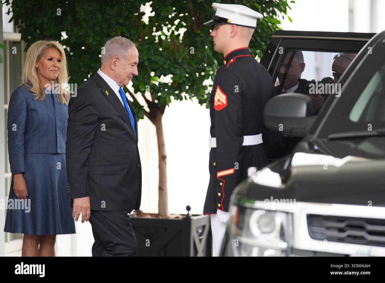 Israeli Prime Minister Benjamin Netanyahu, center, departs as Monica ...
