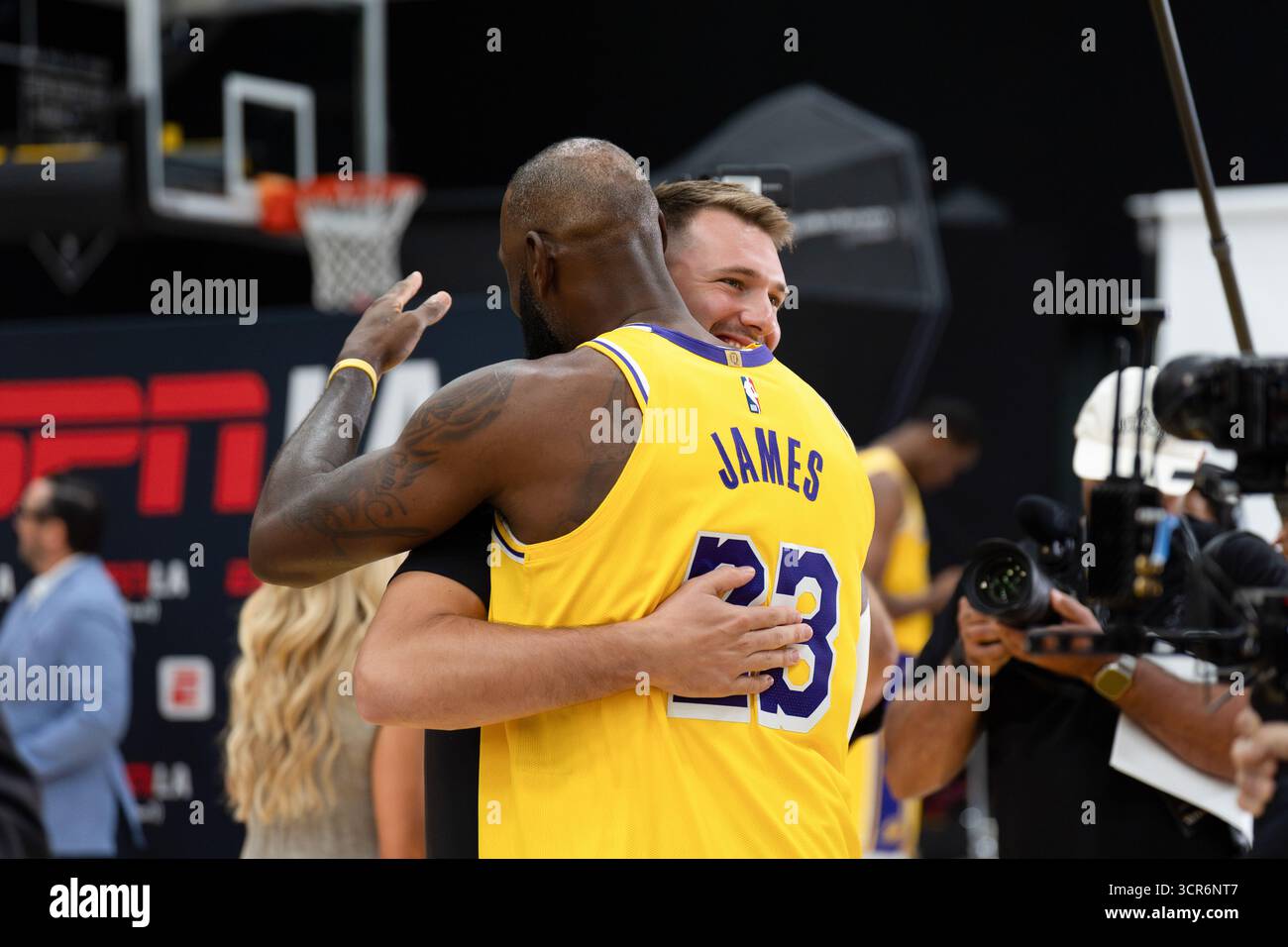 Los Angeles Lakers' LeBron James (23) and Luka Doncic (77) hug during ...