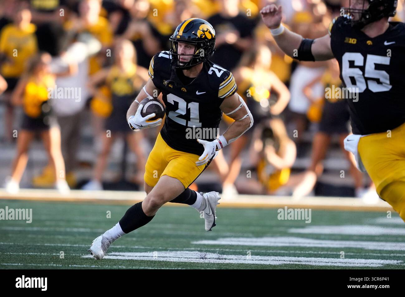 Iowa wide receiver Kaden Wetjen (21) returns a punt during the second ...