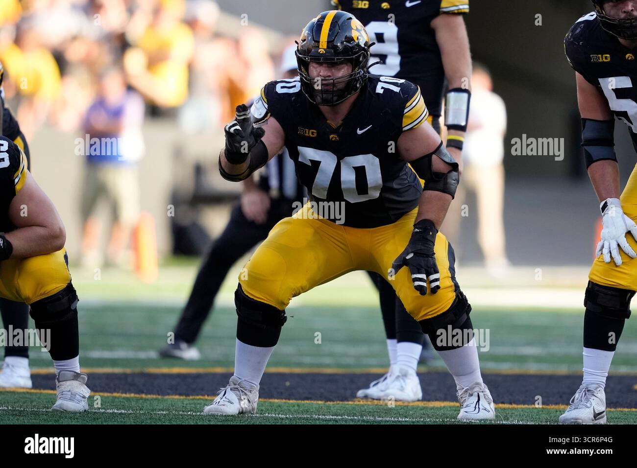 Iowa offensive lineman Beau Stephens (70) gets set for a play during ...