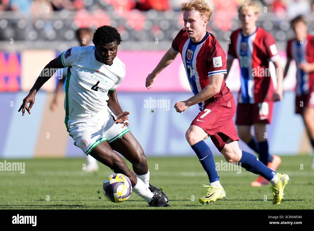 Nigeria's Daniel Daga, left, and Norway's Markus Haaland vie for the ...