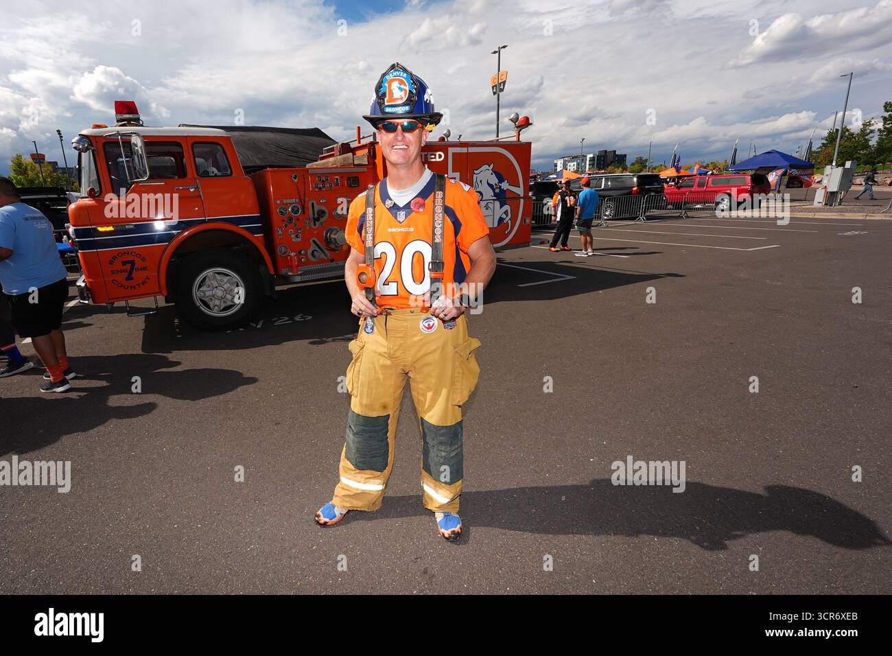 Rob the fireman stands near his rig outside Empower Field at Mile High ...