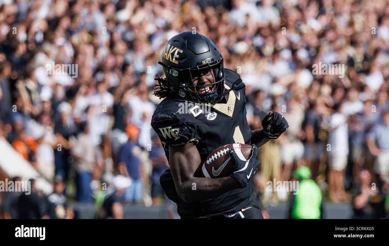 Wake Forest's Demond Claiborne (1) carries the ball during an NCAA ...