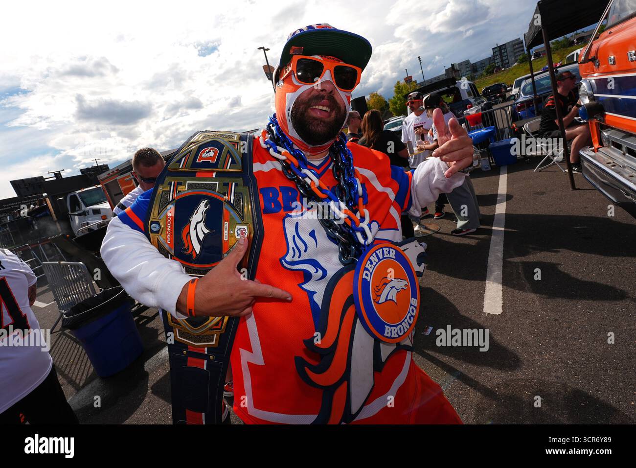 Reilly Pitzer of Denver displays his team's colors outside Empower ...