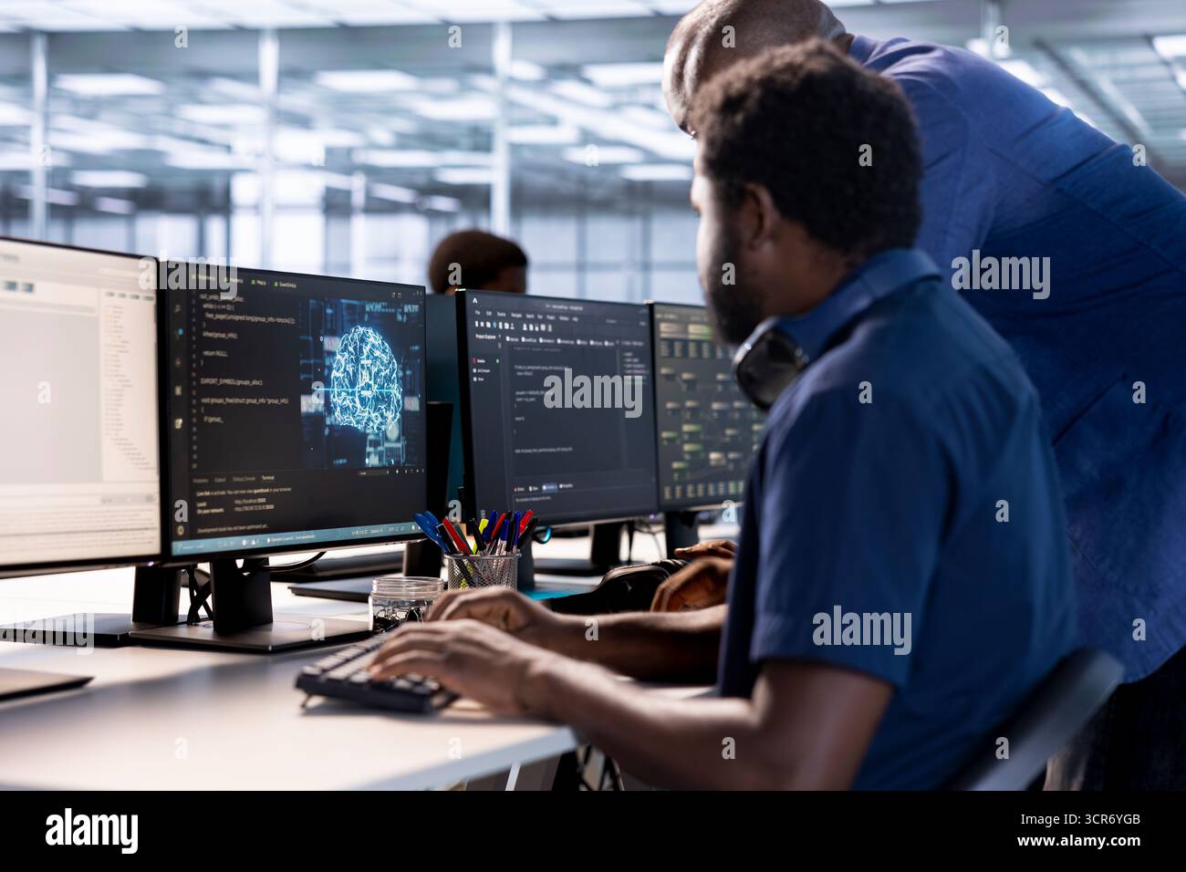 Team of server farm coworkers using AI systems to input data faster ...