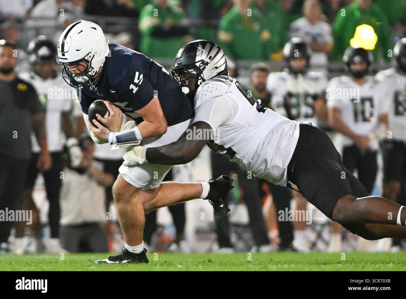Oregon defensive lineman Terrance Green (99) tackles Penn State ...