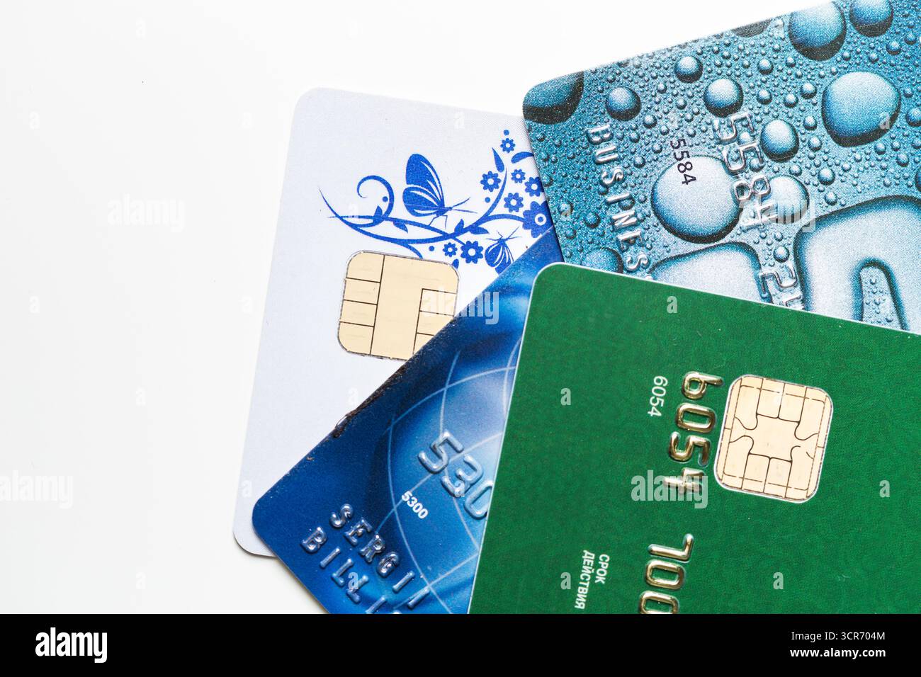 Different types of credit cards arranged on a white background with ...